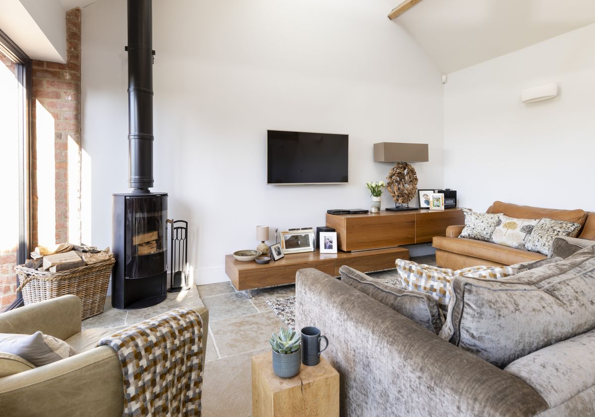 Corner log burner ideas for a cosy living space | Homebuilding