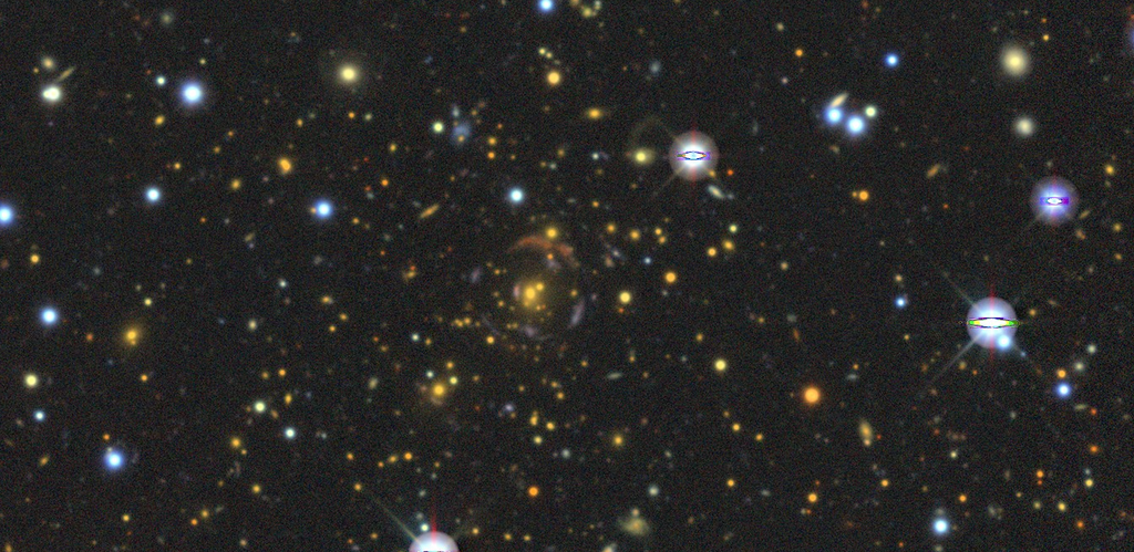 The largest Einstein Cross ever discovered dwells among a rare ...