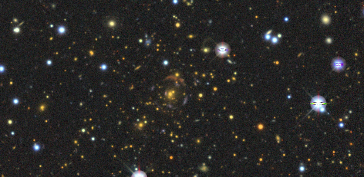 The largest Einstein Cross ever discovered dwells among a rare ...