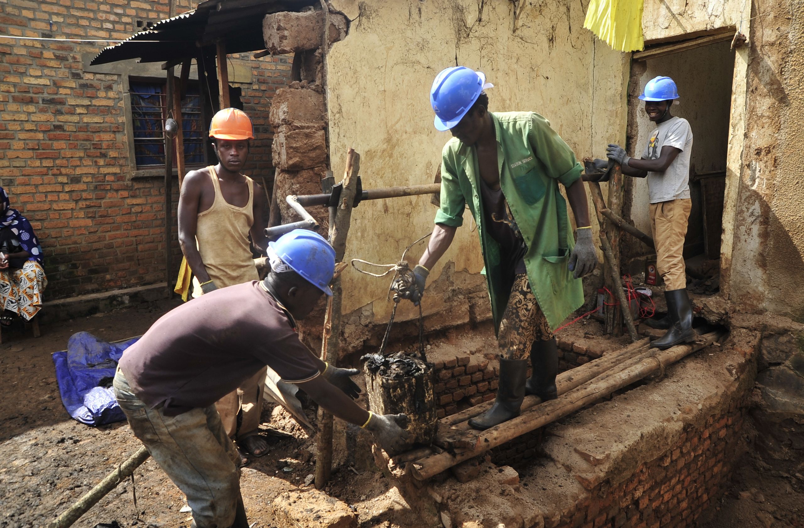 2 decades after genocide, mass graves containing thousands of bodies ...