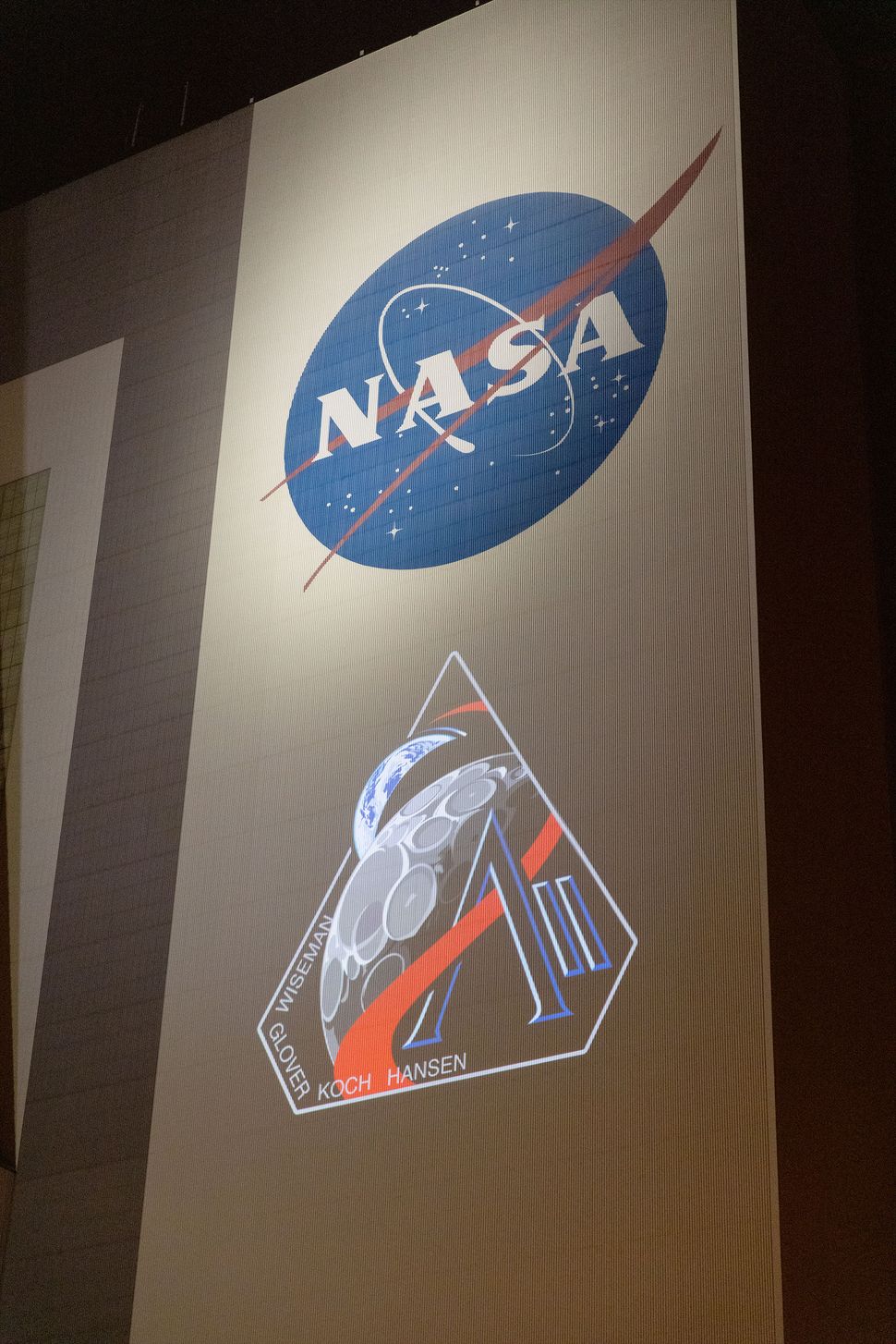 Moon mission patch projected onto assembly building: Space photo of the ...