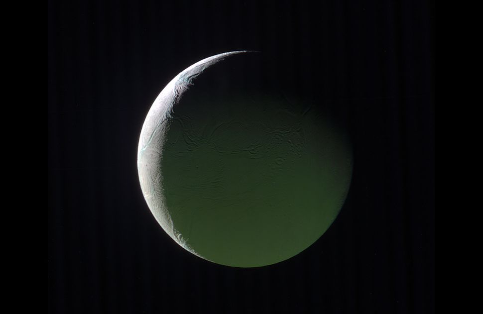 Crescent Enceladus: Icy Saturn Moon Shines in Cassini Photo | Space