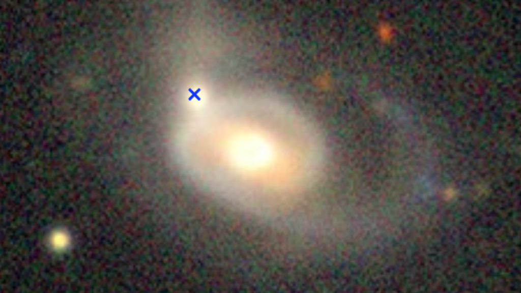Astronomers discover black hole ripping star apart inside galaxy merger ...