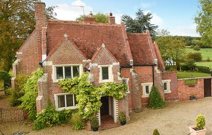 The late medieval farmhouse with part-moated gardens and grounds ...