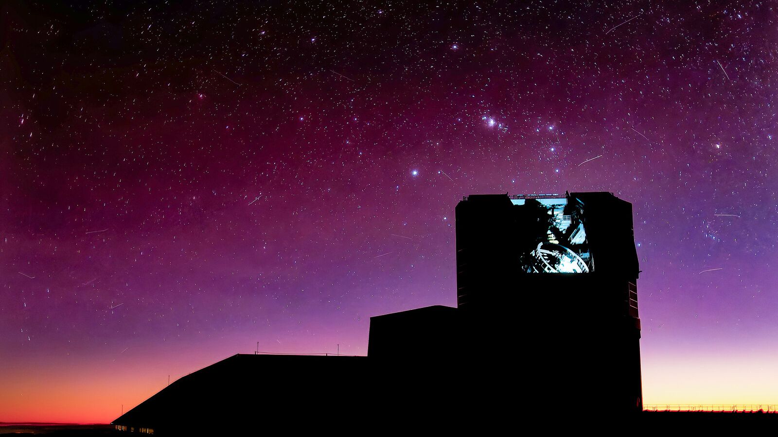 Night sky glows purple above Vera Rubin Observatory photo of the day ...