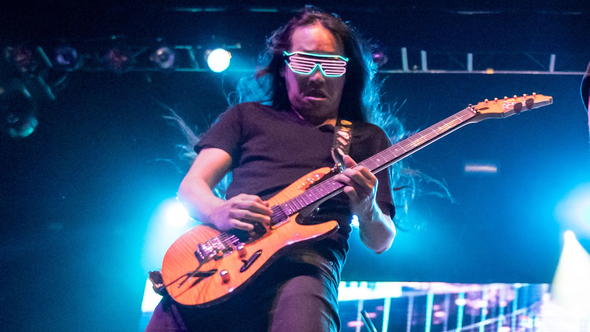 Watch the moment a crew member fails to catch Herman Li's guitar after ...