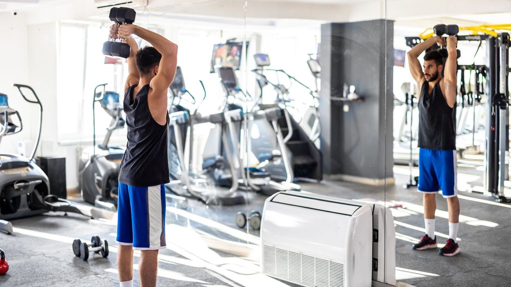 How To Do The Overhead Dumbbell Triceps Extension | Coach