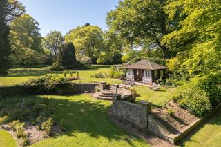 A grand country house tucked away within exquisite gardens, four miles ...