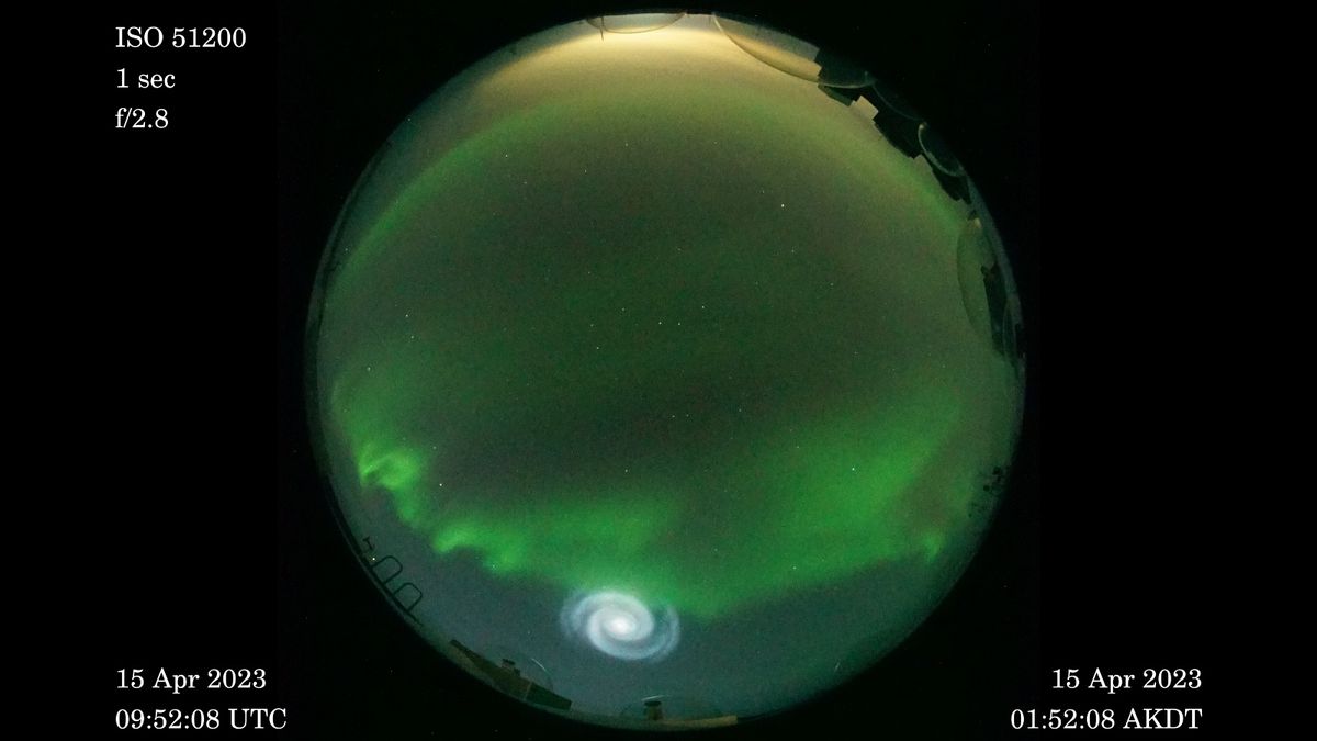 Ethereal whirlpool of light grows into a giant, perfect spiral above ...