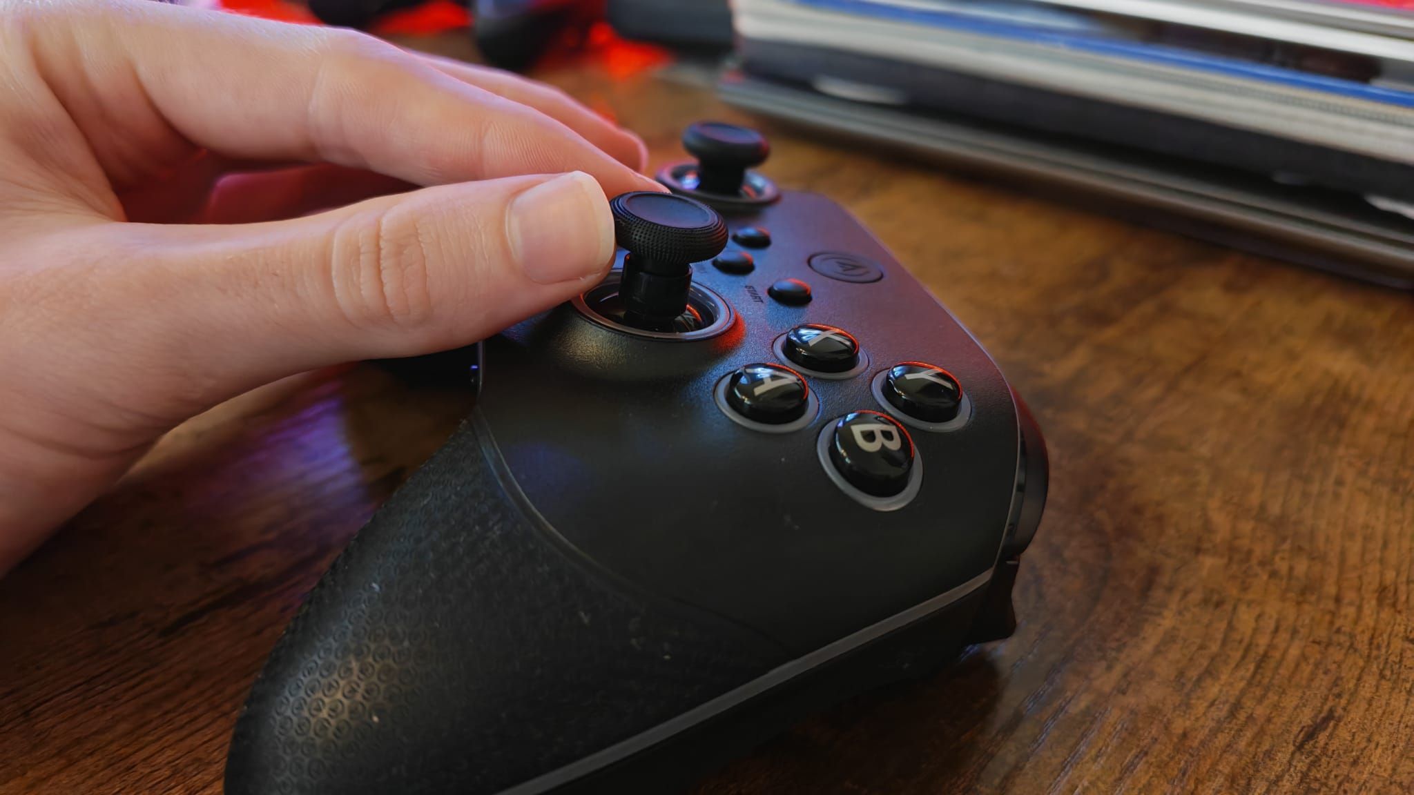 You can adjust this controller's thumbstick height by twisting them ...