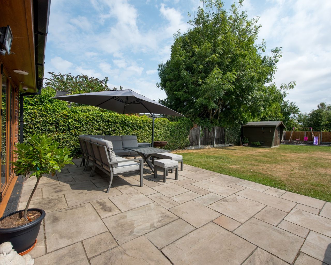 How to clean a patio without a pressure washer in 4 steps | Real Homes