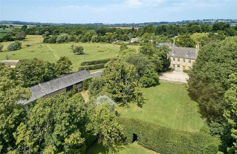 A politely symmetrical 18th century Cotswolds house, owned by the same ...