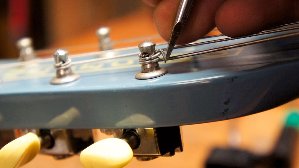 A tech explains how to change your electric guitar strings like a pro ...