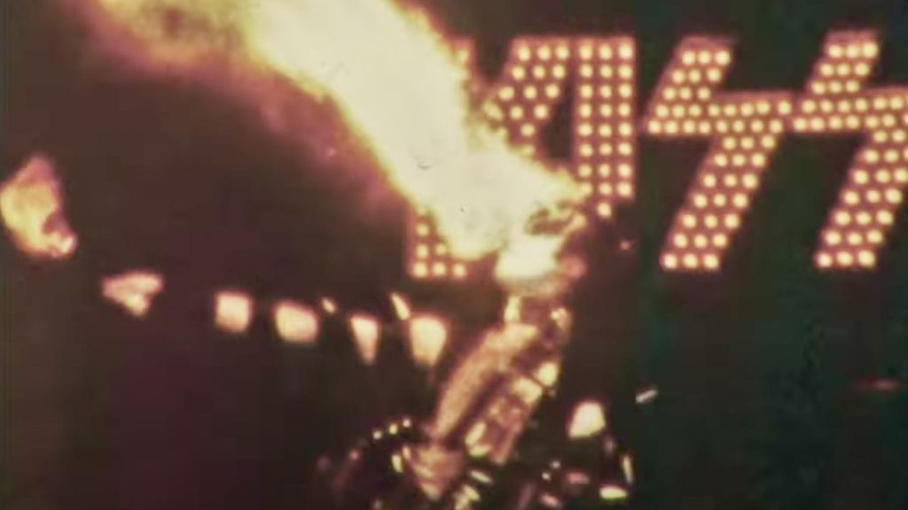 Watch the moment Kiss’ Gene Simmons set his hair on fire during a 1973 ...