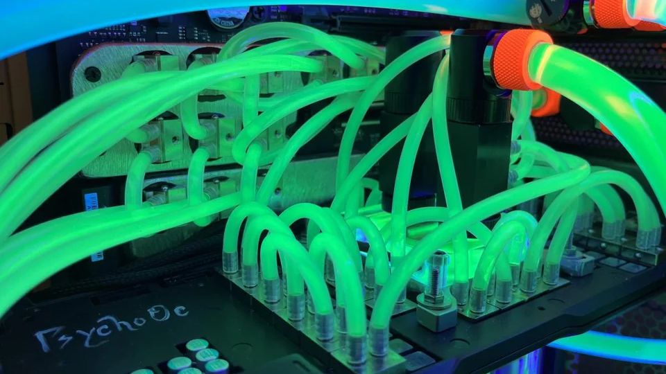 This fluorescent gaming PC has 69 water blocks to keep it frosty | PC Gamer