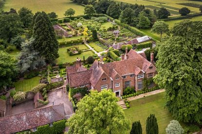 An enhanced Elizabethan Manor house in Kent with gardens by Gertrude ...