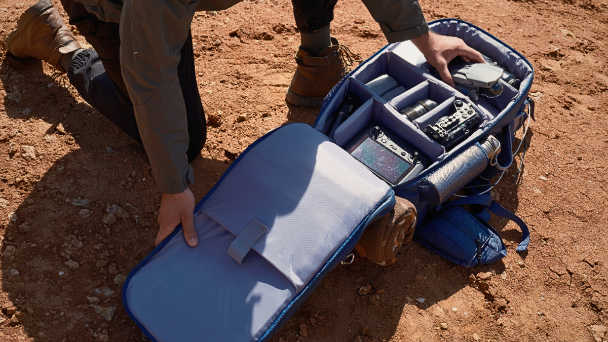 This solar-powered backpack charges your camera kit as you hike ...