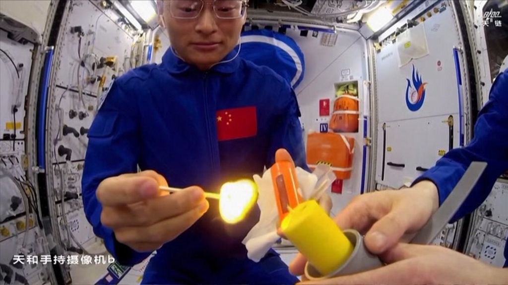 Watch Chinese astronauts light a match on Tiangong space station (video ...