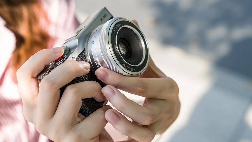 Complete your retro camera look with this sleek silver pancake lens ...