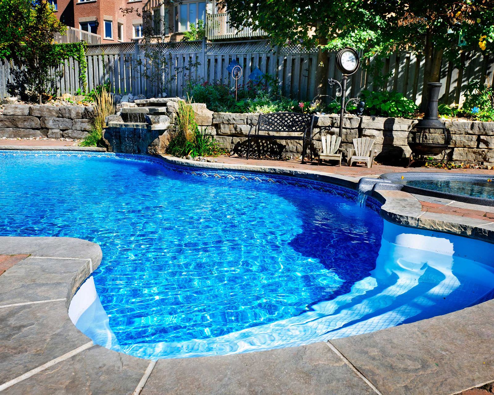Pool waterfall ideas: 10 looks to elevate your swimming pool | Gardeningetc