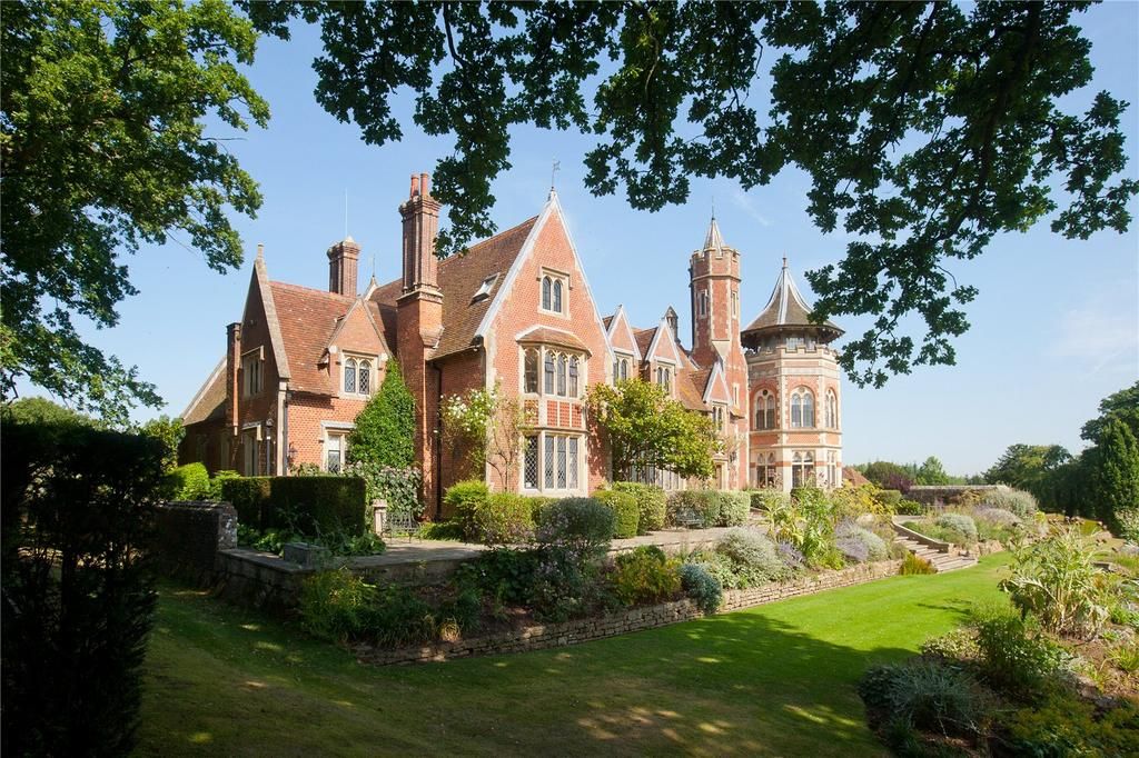 An £18 million Surrey mansion, with vaulted hall, turrets, and a ...