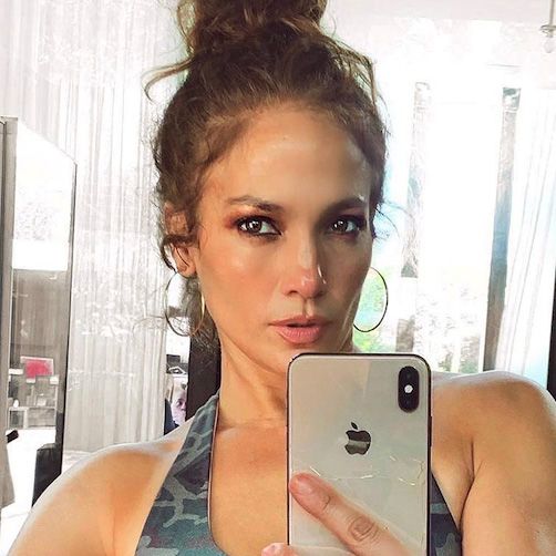 Jennifer Lopez Just Wore a Miniskirt With Go-Go Boots | Who What Wear