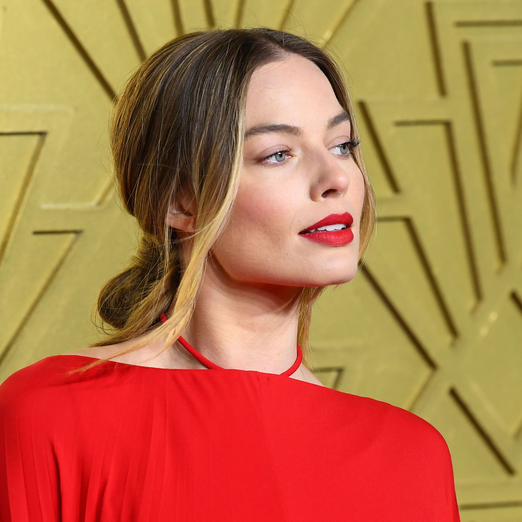 Margot Robbie Wore a Backless Caped Gown in London | Who What Wear