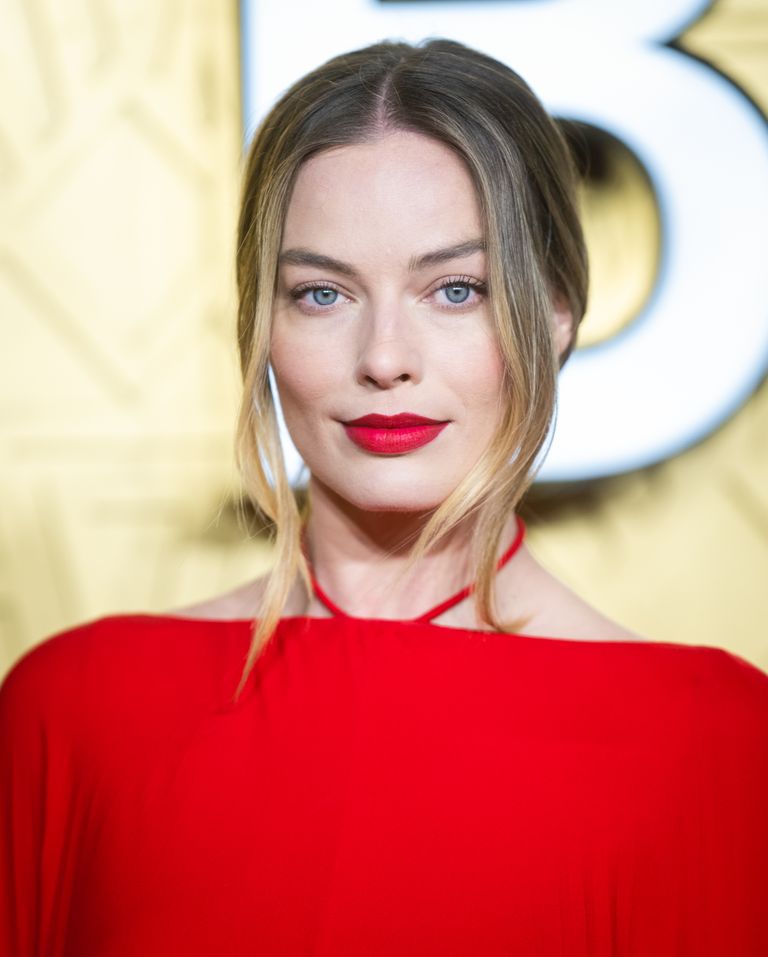 Margot Robbie Wore a Backless Caped Gown in London | Who What Wear