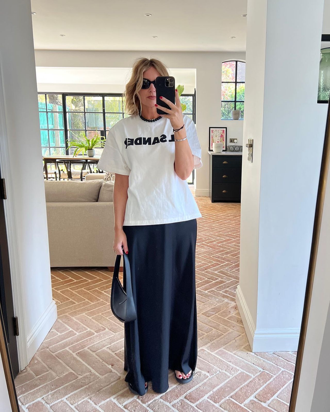 The Row's Half Moon Bag Is on Every Editor's Wish List | Who What Wear