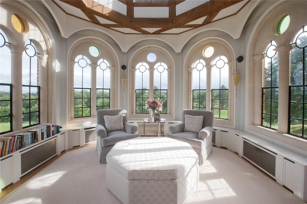 An £18 million Surrey mansion, with vaulted hall, turrets, and a ...