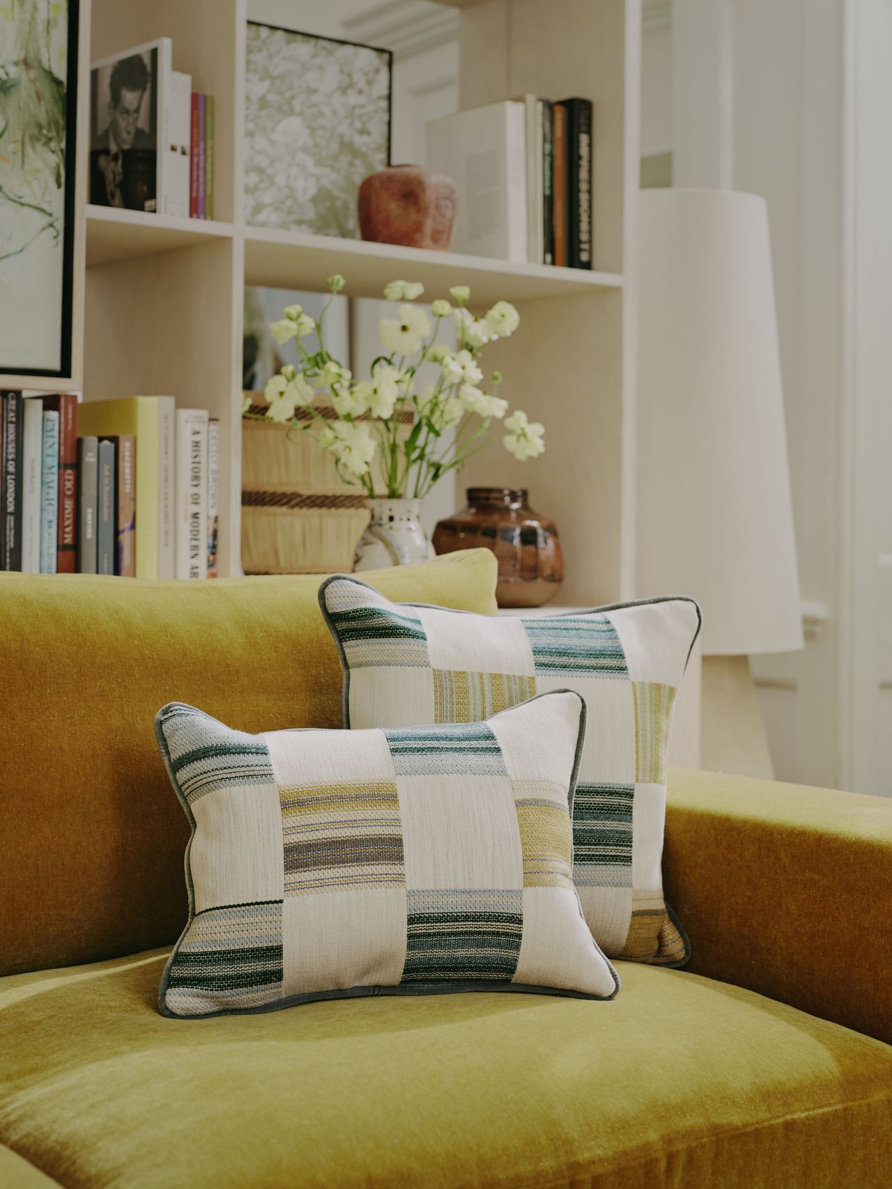 Designers are accessorizing their couches with this style of couch ...