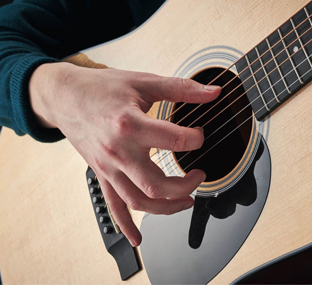 How to play fingerstyle guitar: learn fingerpicking styles | Guitar World