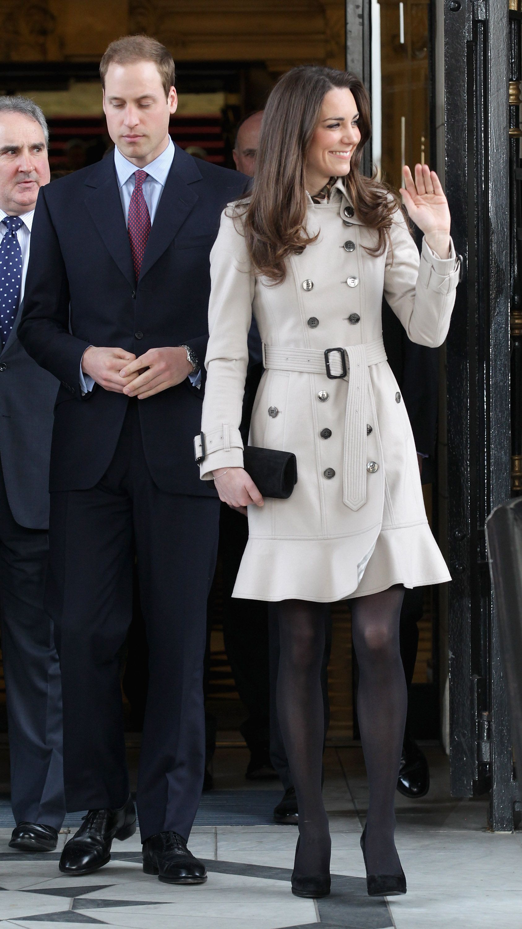 Kate Middleton's short Burberry trench coat with sheer black tights and ...