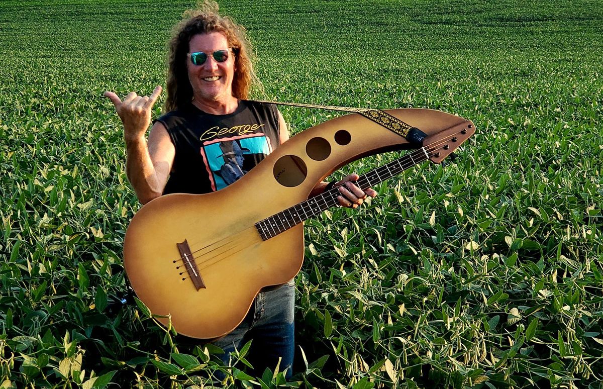 This wild trapezoidal flatback four-string is said to have more volume ...